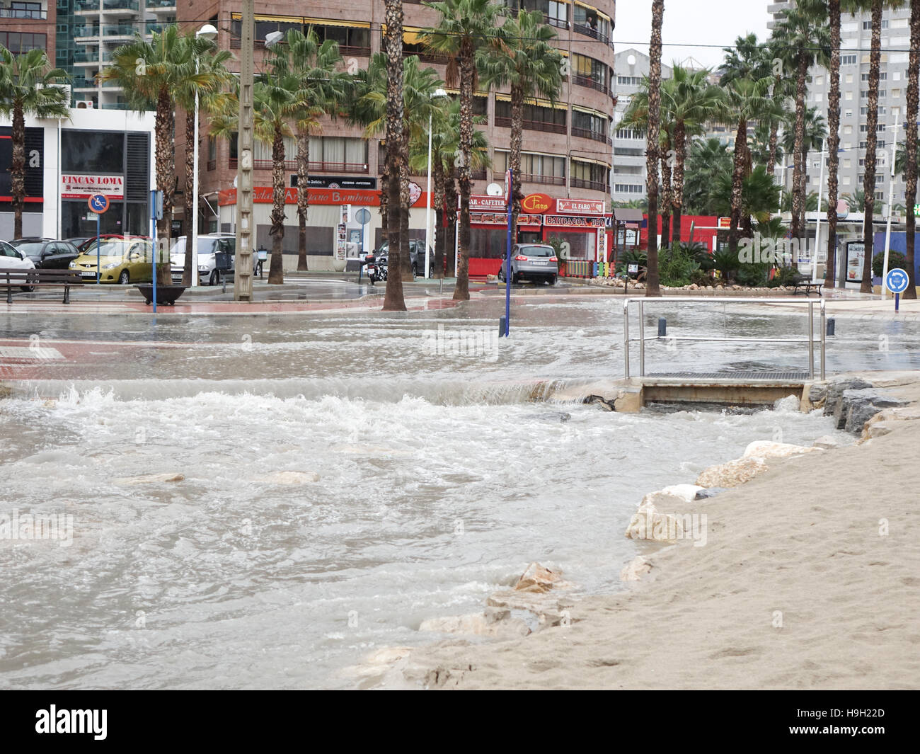 Vehicles drive through flooded streets in La Cala, Benidorm, Alicante ...