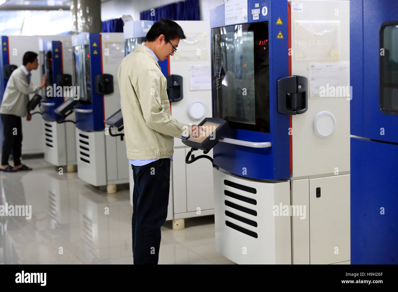 Shenzhen, China's Guangdong Province. 22nd Nov, 2016. Technicians work ...