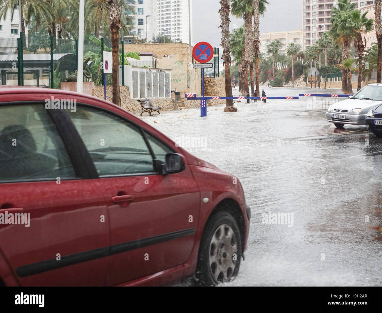 Vehicles drive through flooded streets in La Cala, Benidorm, Alicante ...