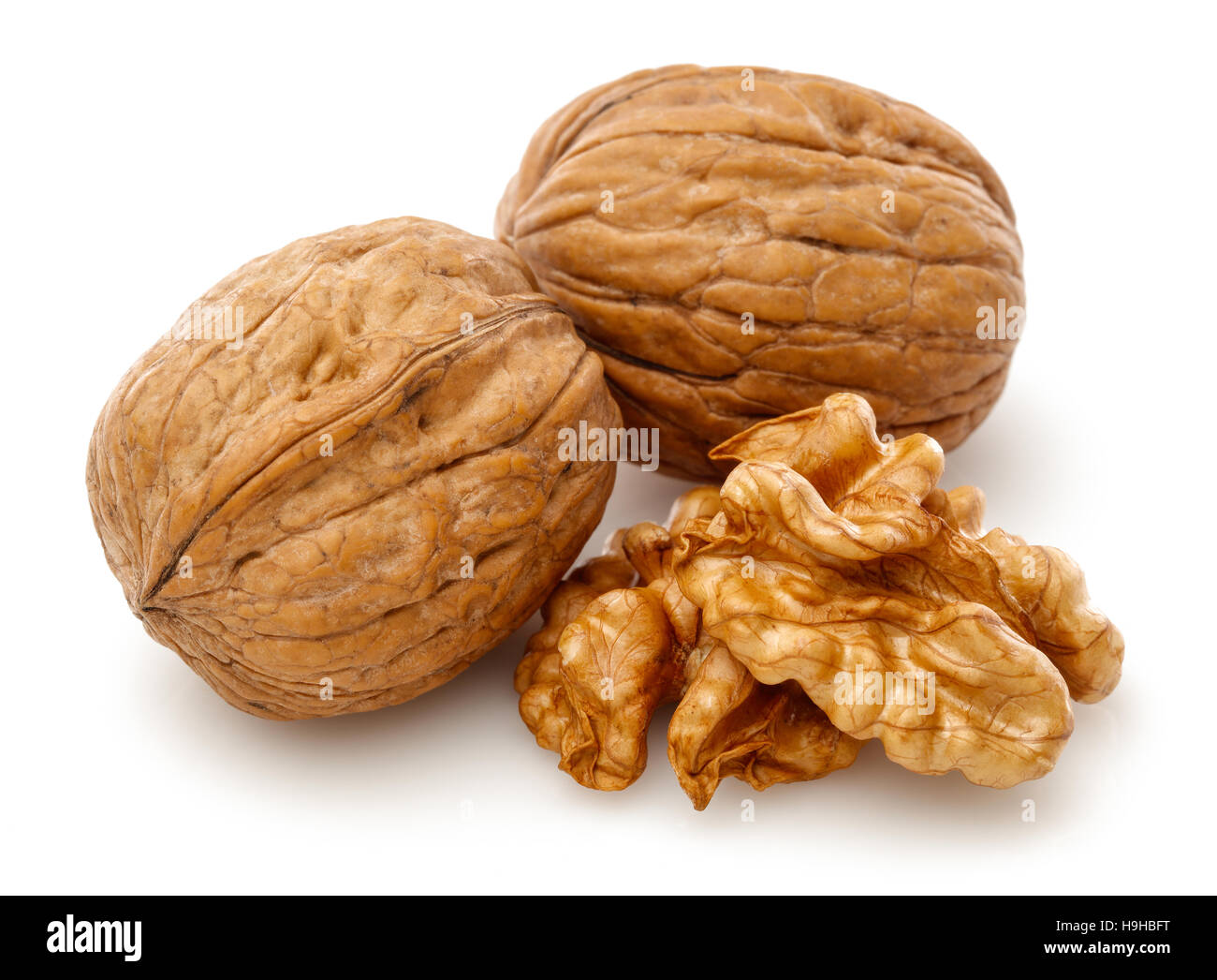 Peeled walnut kernel and whole walnut. Isolated on a white background ...