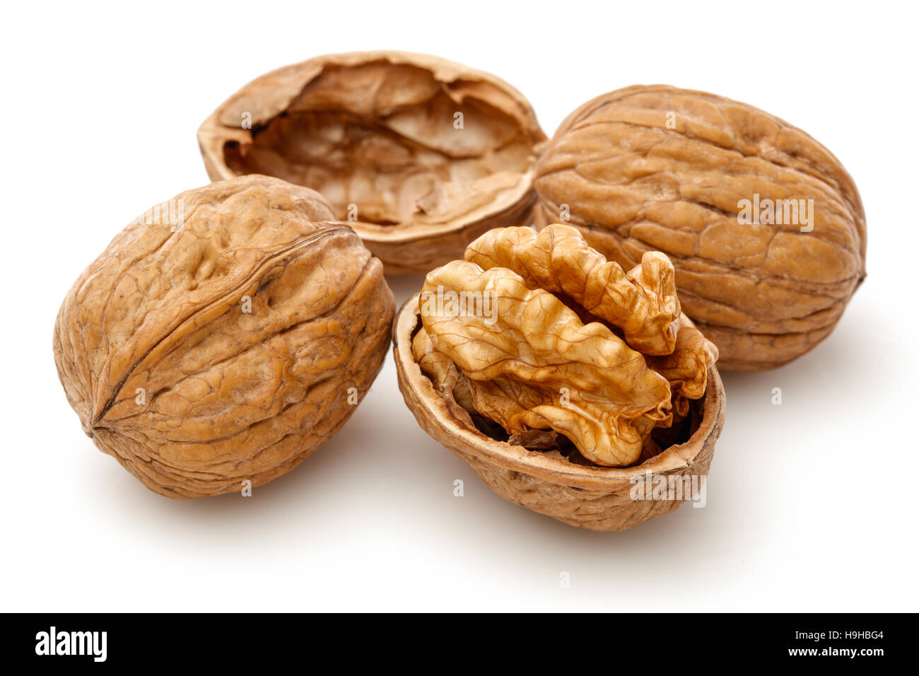 Half walnut kernel and whole walnut. Isolated on a white background ...