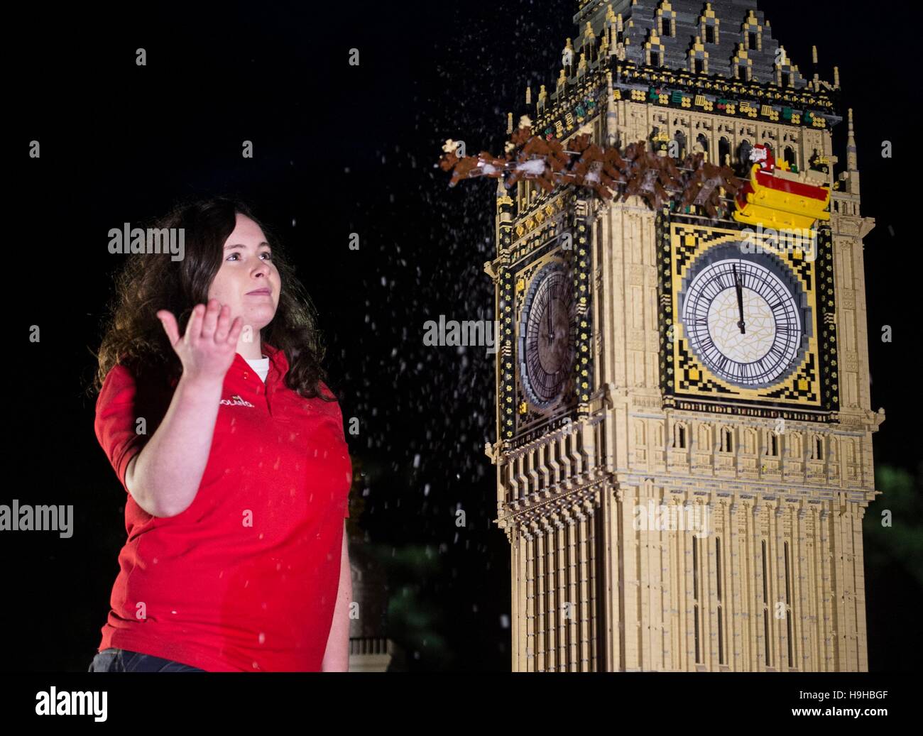 Model maker Amanda Green sprinkles fake snow over a Lego model of Big ...