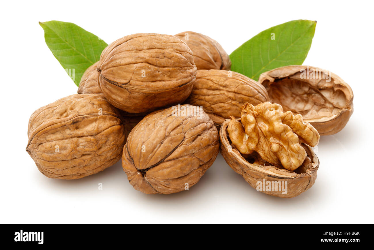 Half walnut kernel and whole walnut. Isolated on a white background ...