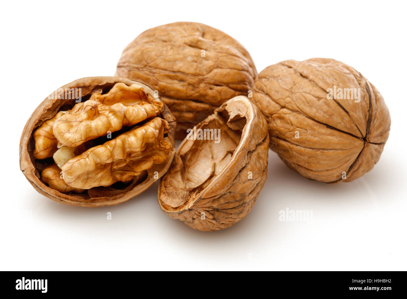 Half walnut kernel and whole walnut. Isolated on a white background ...