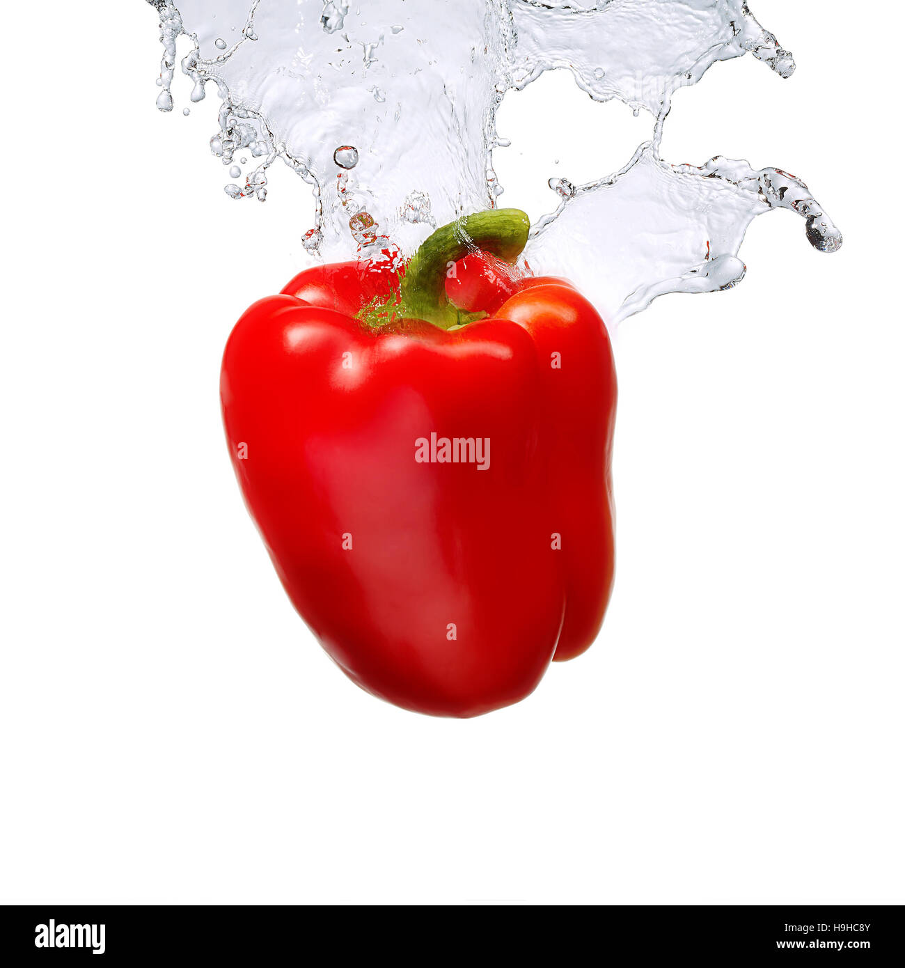 Water splash with bell pepper isolated Stock Photo - Alamy