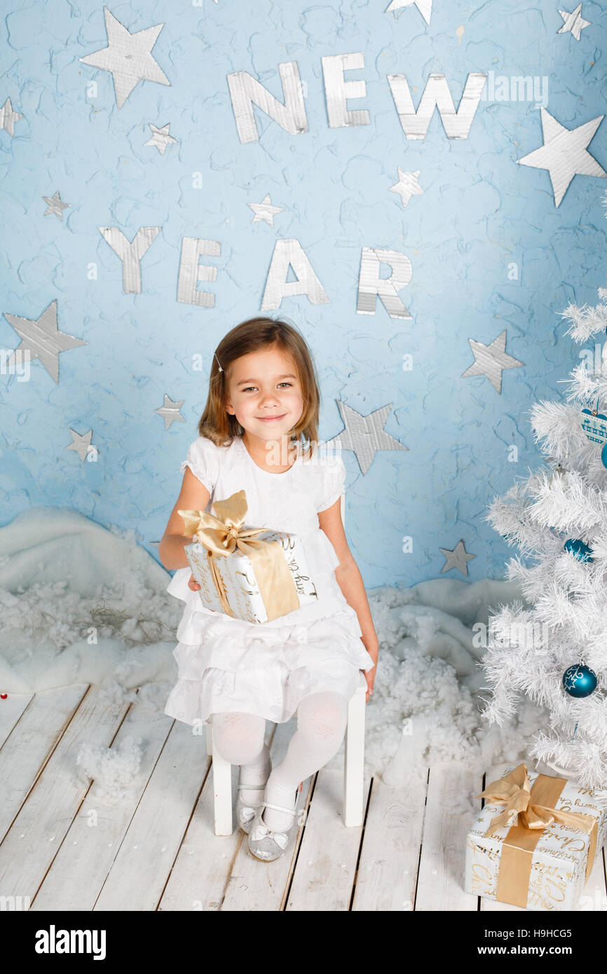 little girl giving a gift and smiling Stock Photo - Alamy