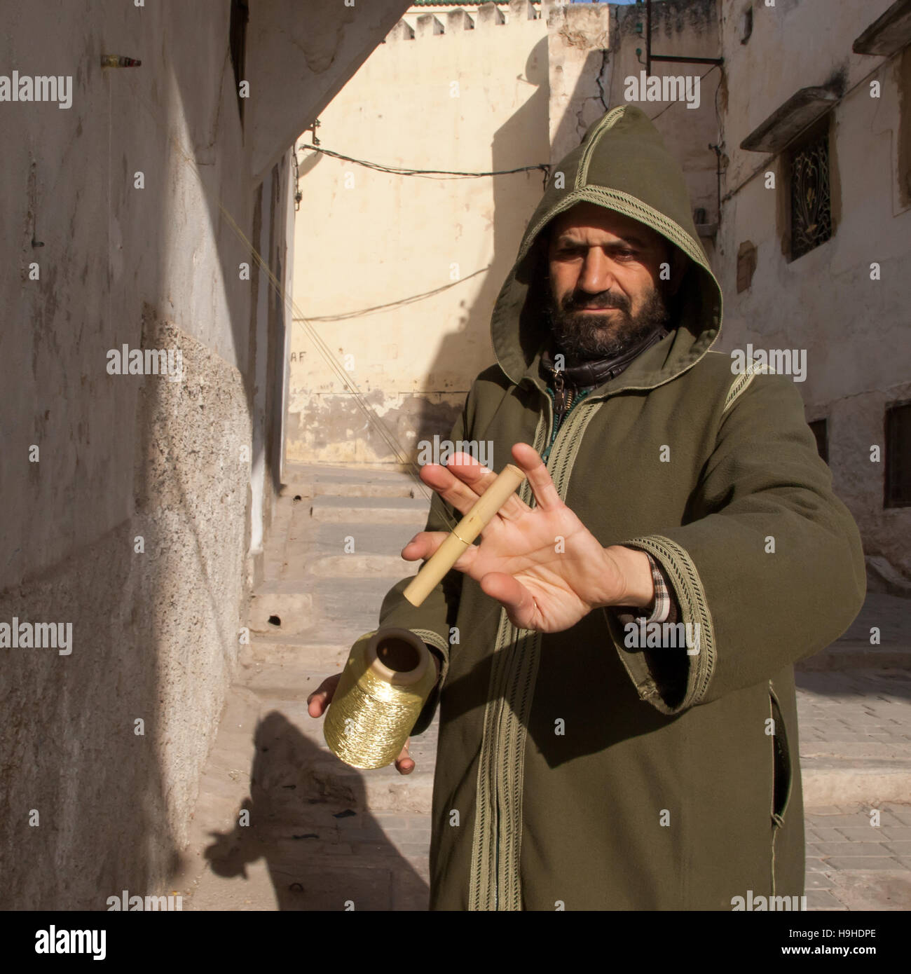 Craftsman stretching yarn in street to spin it afterwards Stock Photo ...