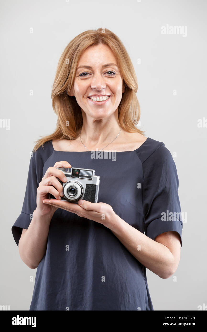 portrait of a real woman ready to shot some photographs with a little ...