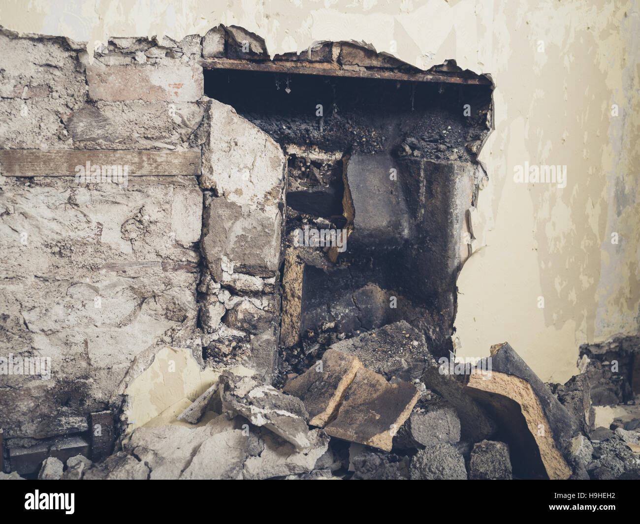 A partially demolished victorian fireplace with the remains of the ...