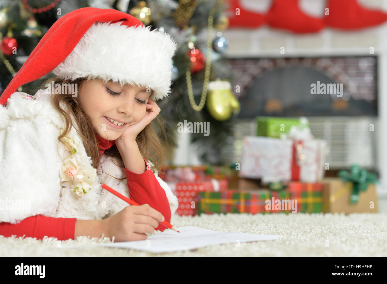 Little girl writing letter Stock Photo - Alamy