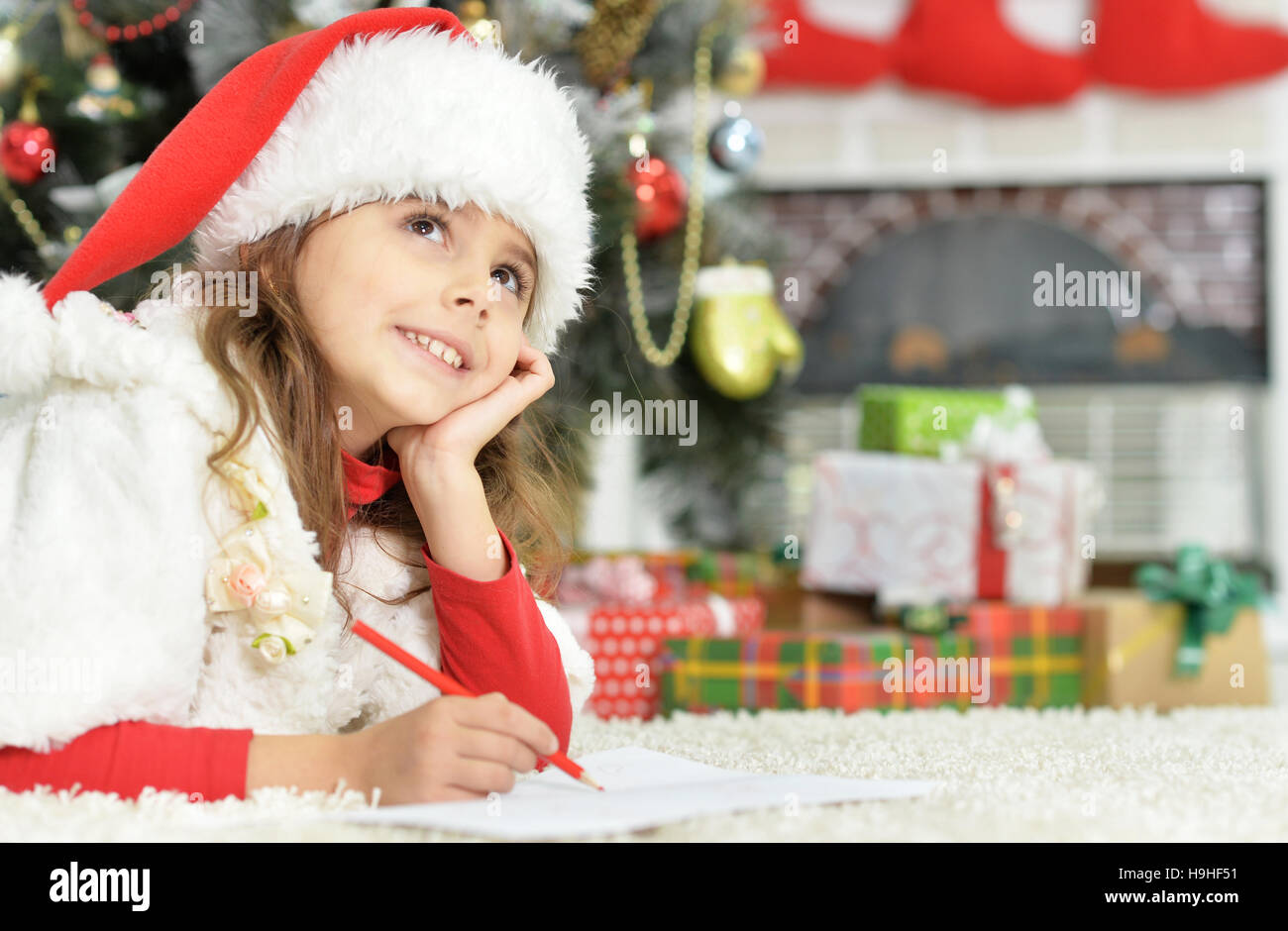 Little girl writing letter Stock Photo - Alamy