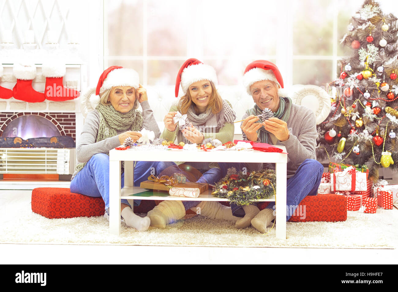 Family preparing for Christmas Stock Photo - Alamy