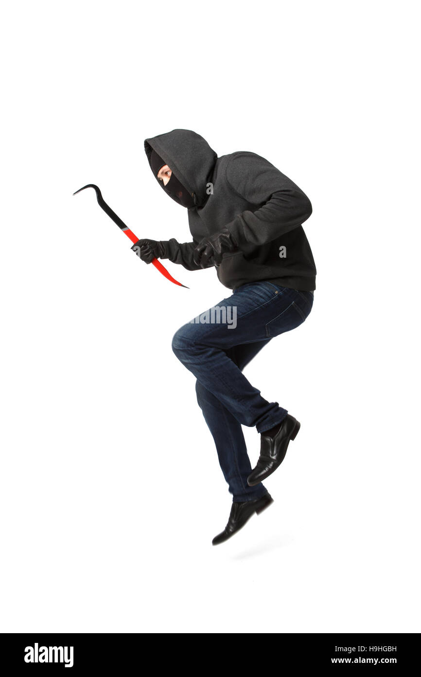 Thief jumps with master key Stock Photo - Alamy