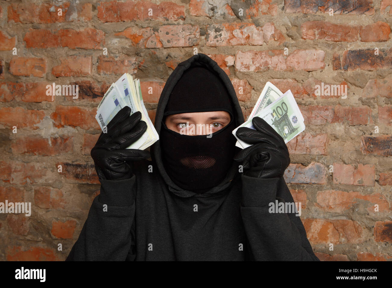 Cracker standing near brick wall Stock Photo - Alamy