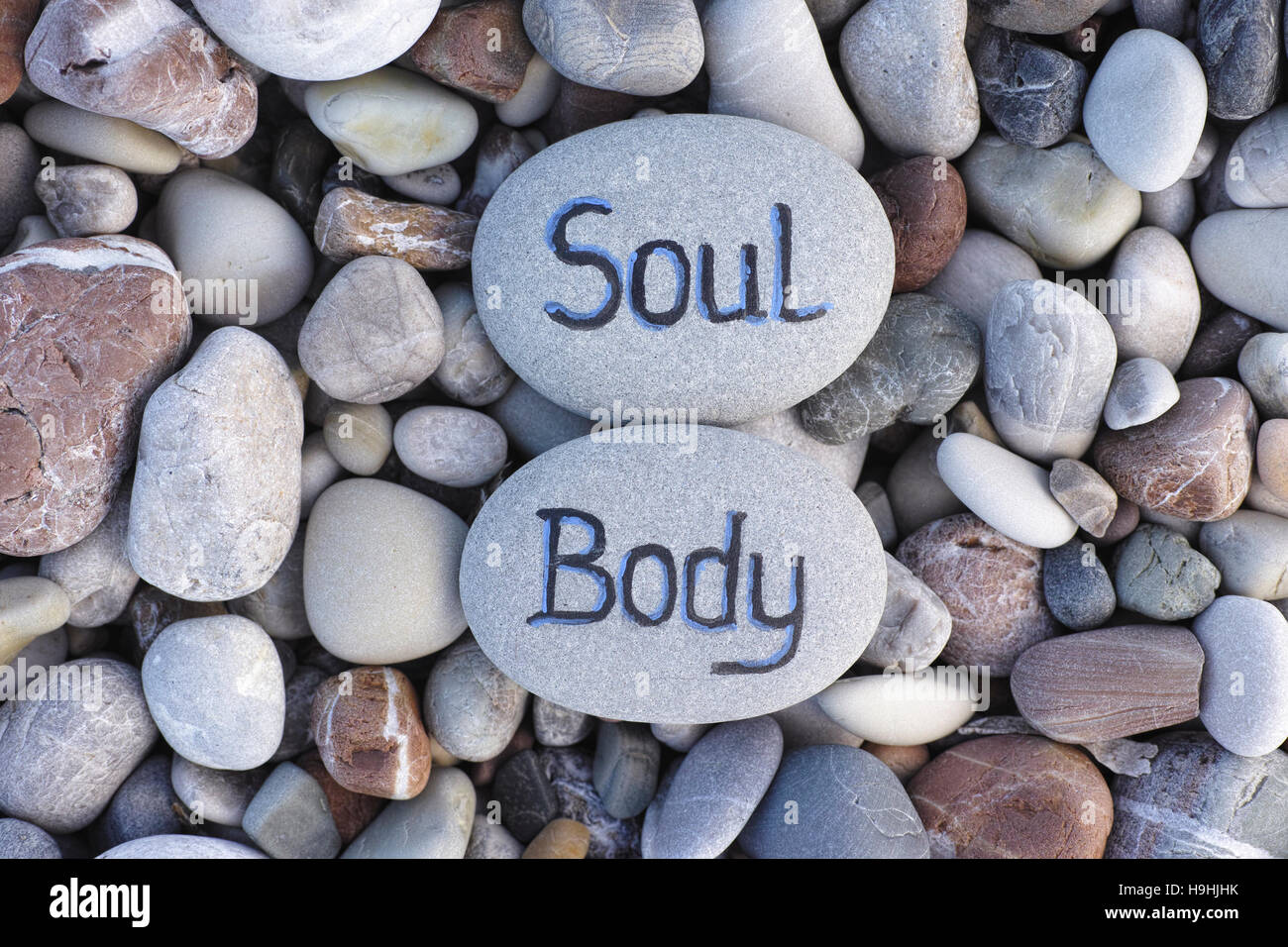 Words Body and Soul written on stones. Close up Stock Photo - Alamy