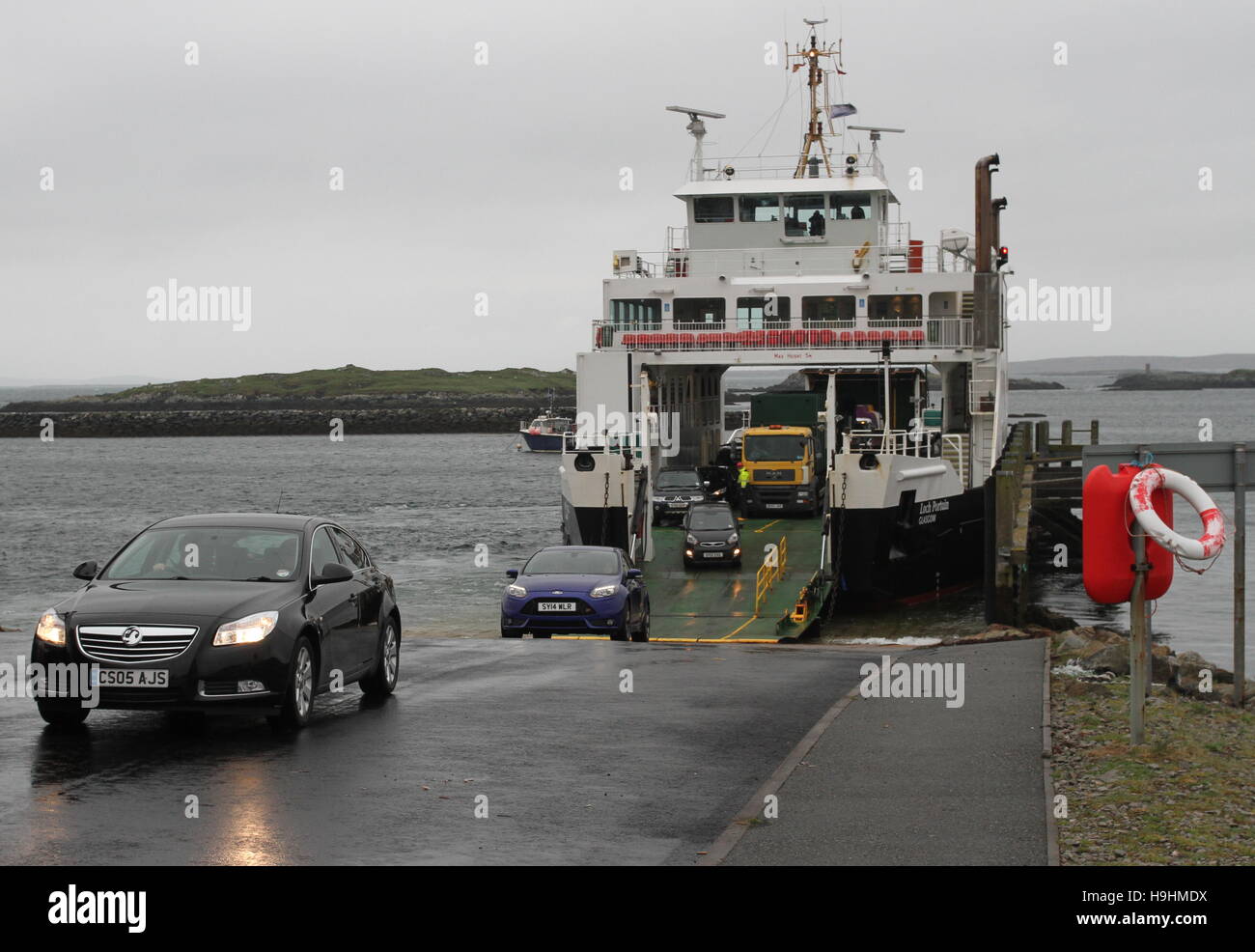 Cars driving off MV Loch Portain Leverburgh Isle of Harris Scotland May ...