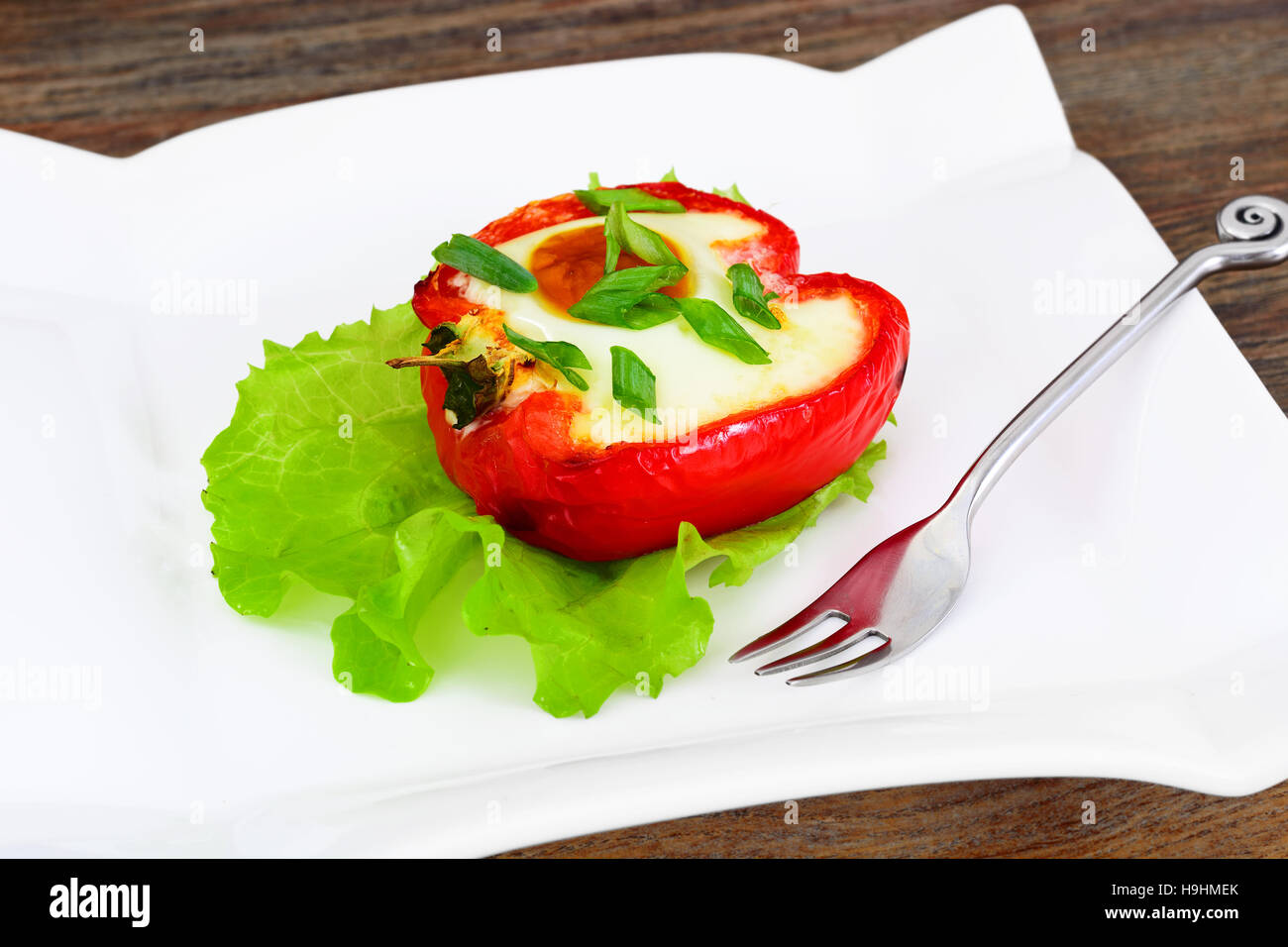 Dietary food without meat: egg, baked in sweet pepper. Studio Photo ...