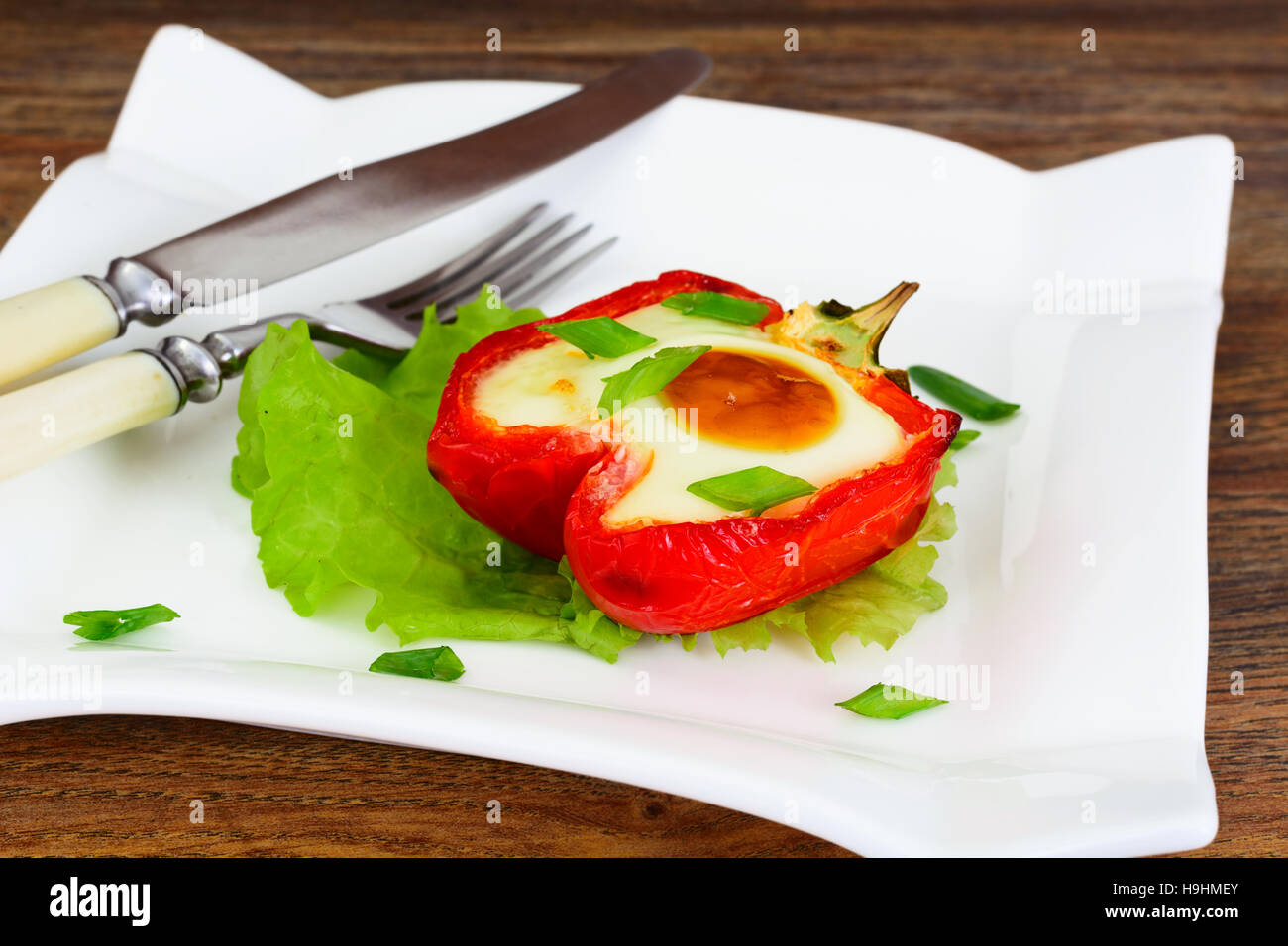 Dietary food without meat: egg, baked in sweet pepper. Studio Photo ...
