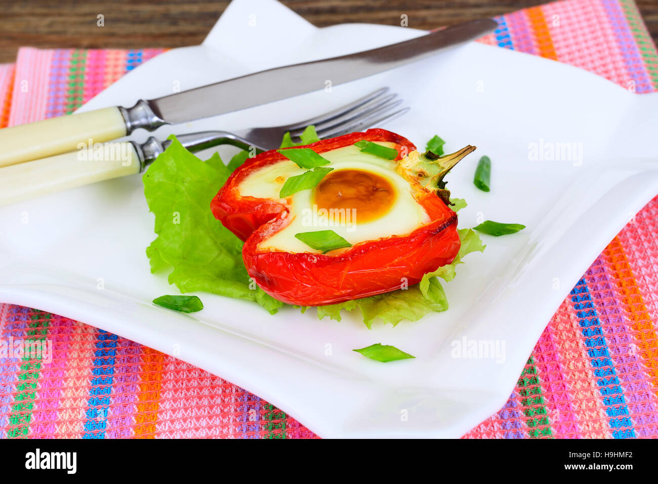 Dietary food without meat: egg, baked in sweet pepper. Studio Photo ...