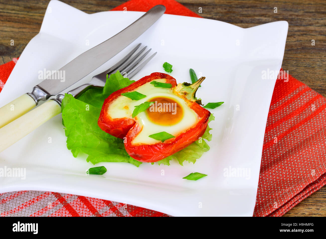 Dietary food without meat: egg, baked in sweet pepper. Studio Photo ...
