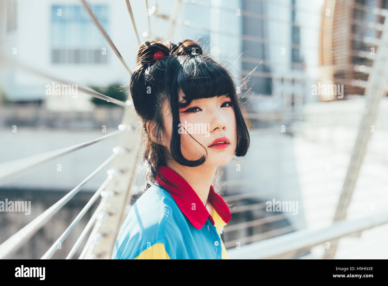 Half length portrait of young beautiful asian millennial woman outdoor ...