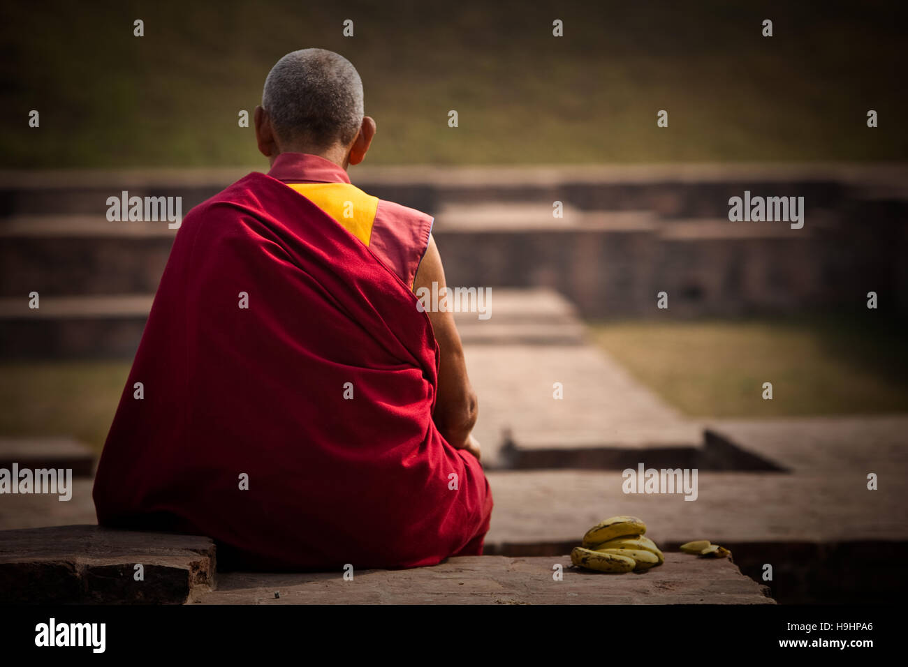 Buddhist monk taking a break in India Stock Photo - Alamy