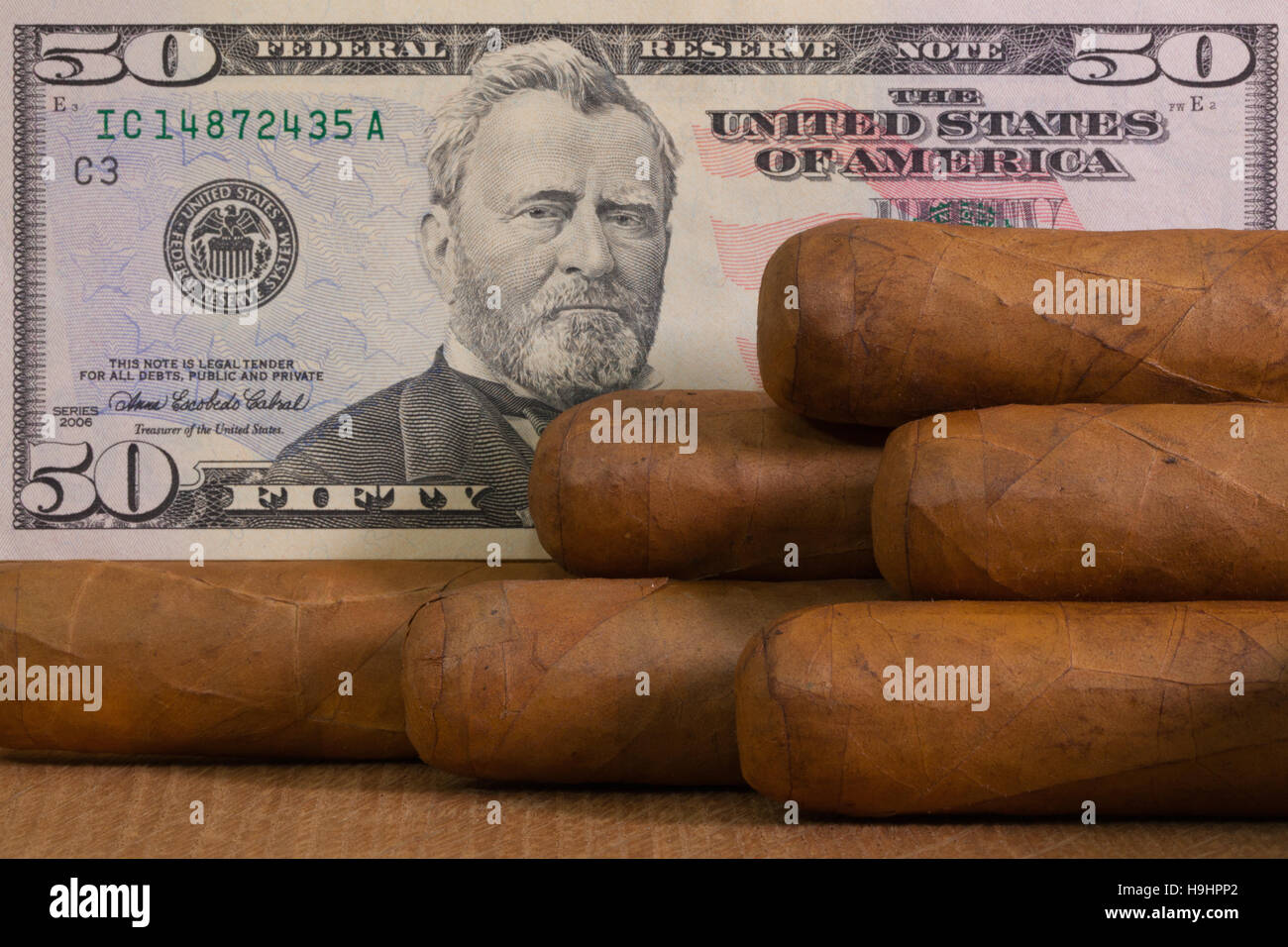 Luxury Cuban cigars with US dollar banknote on the wooden table Stock ...