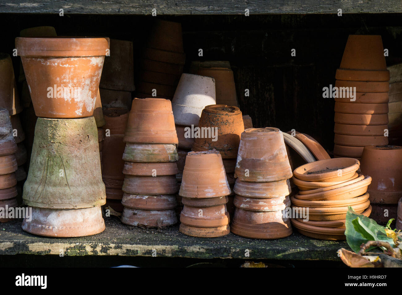 Old rustic vintage stacks of terracotta flower pots Stock Photo - Alamy