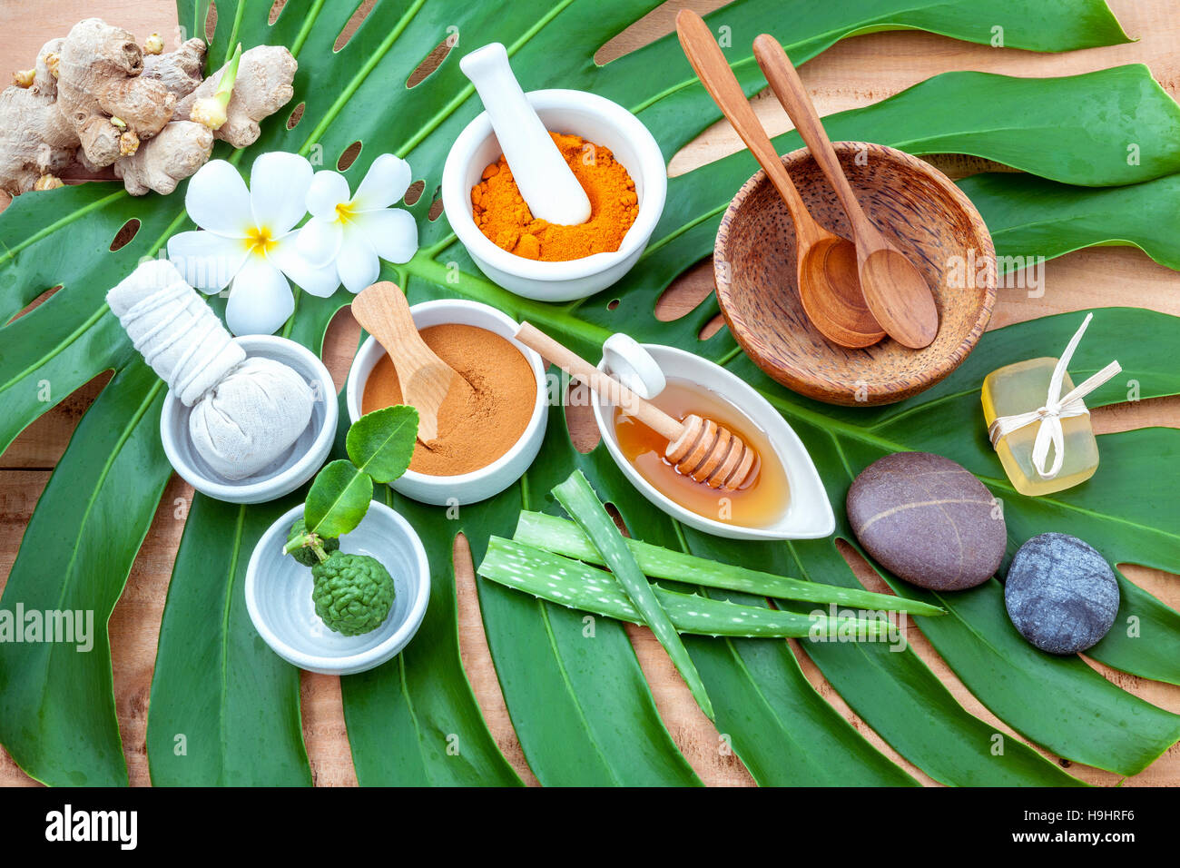 Green leaves with nature spa ingredient turmeric powder in white Stock ...