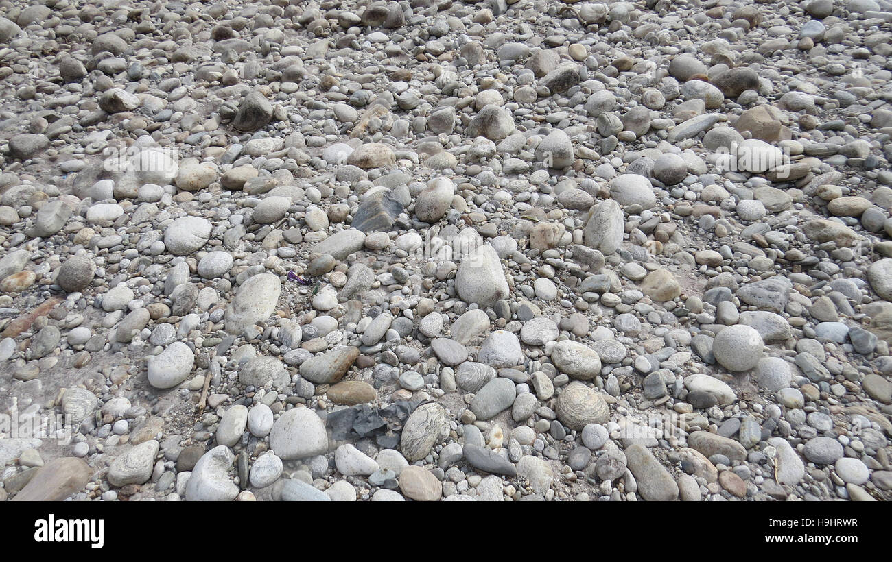 RIVER WASHED PEBBLES in Bhutan. Photo Tony Gale Stock Photo - Alamy