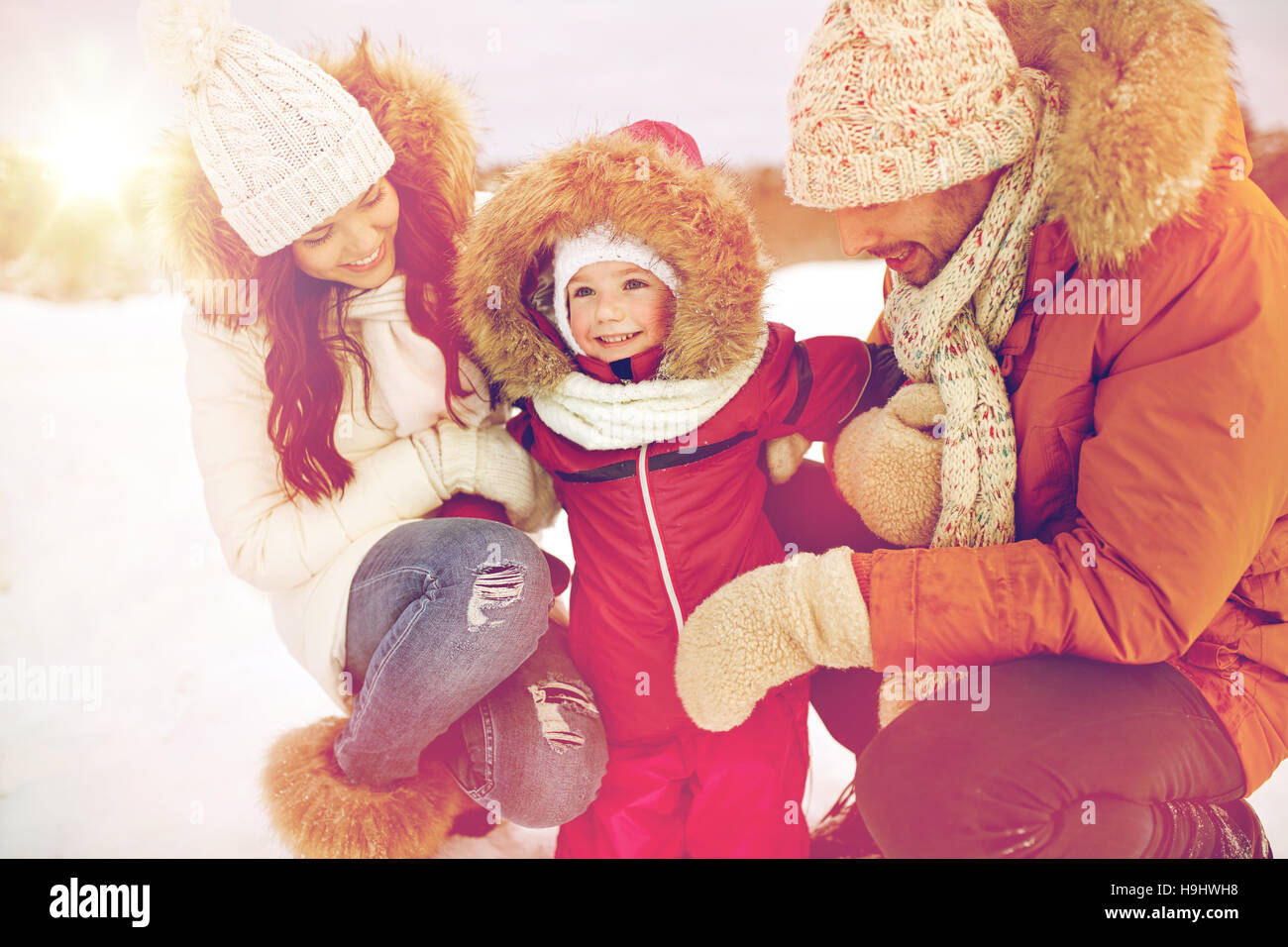 happy family with child in winter clothes outdoors Stock Photo - Alamy