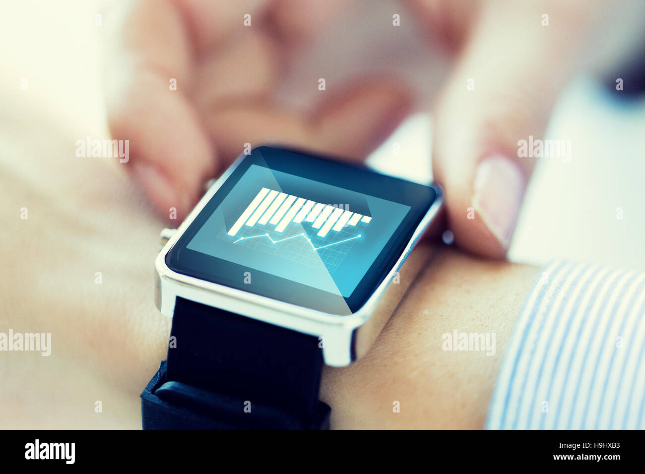close up of hands with chart on smartwatch screen Stock Photo - Alamy