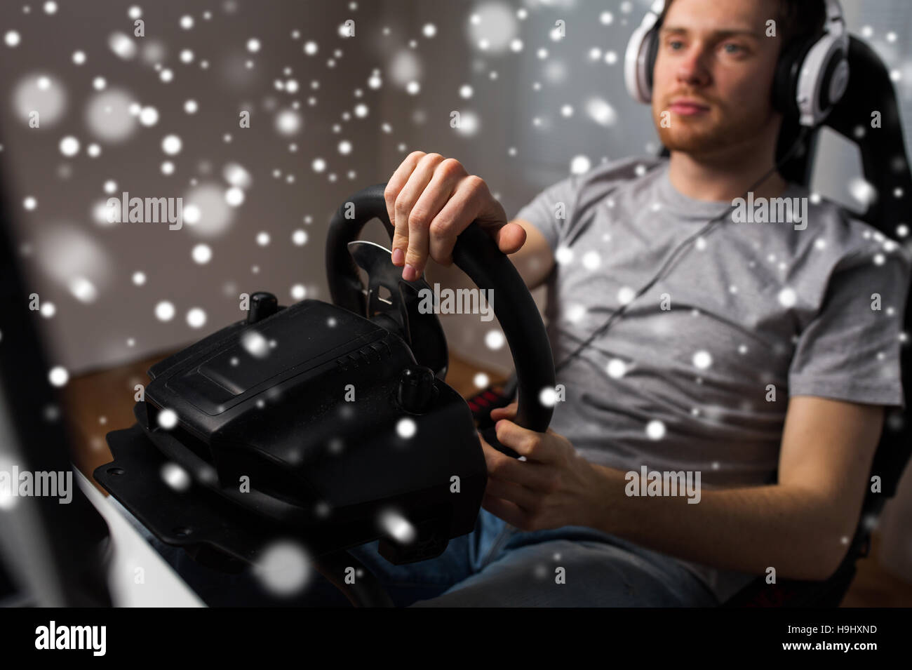 man playing car racing video game at home Stock Photo - Alamy