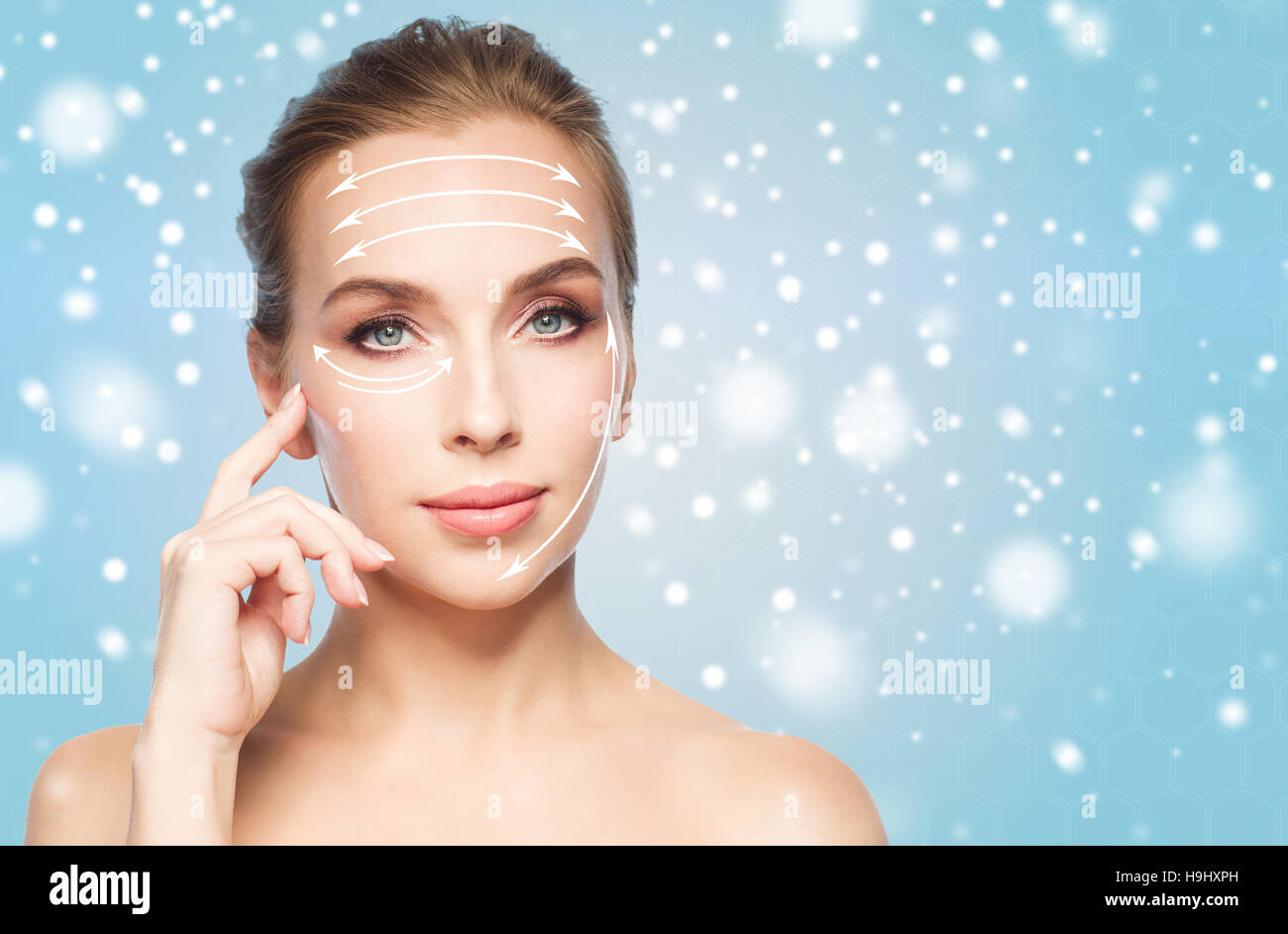 beautiful young woman with lifting arrows on face Stock Photo - Alamy