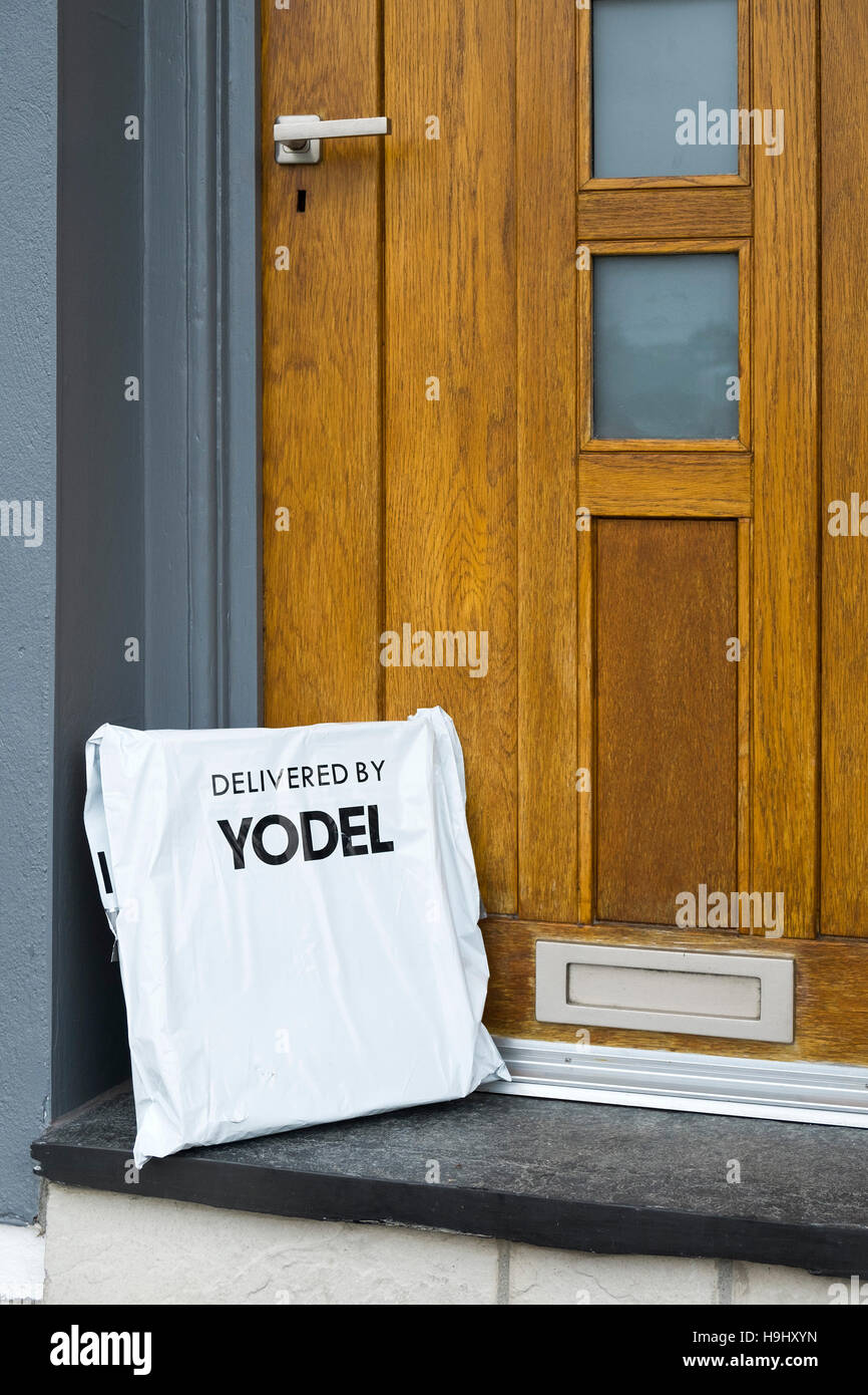 A parcel delivered to a house by Yodel and left on the doorstep Stock ...