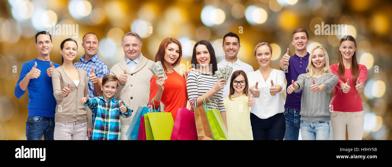 happy people with shopping bags and money Stock Photo - Alamy