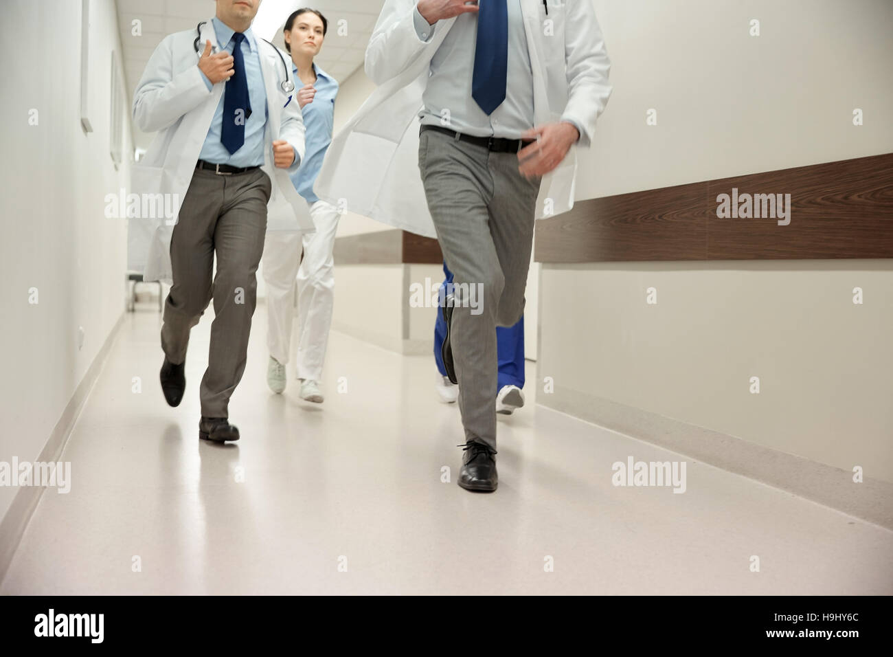 close up of medics or doctors running at hospital Stock Photo - Alamy