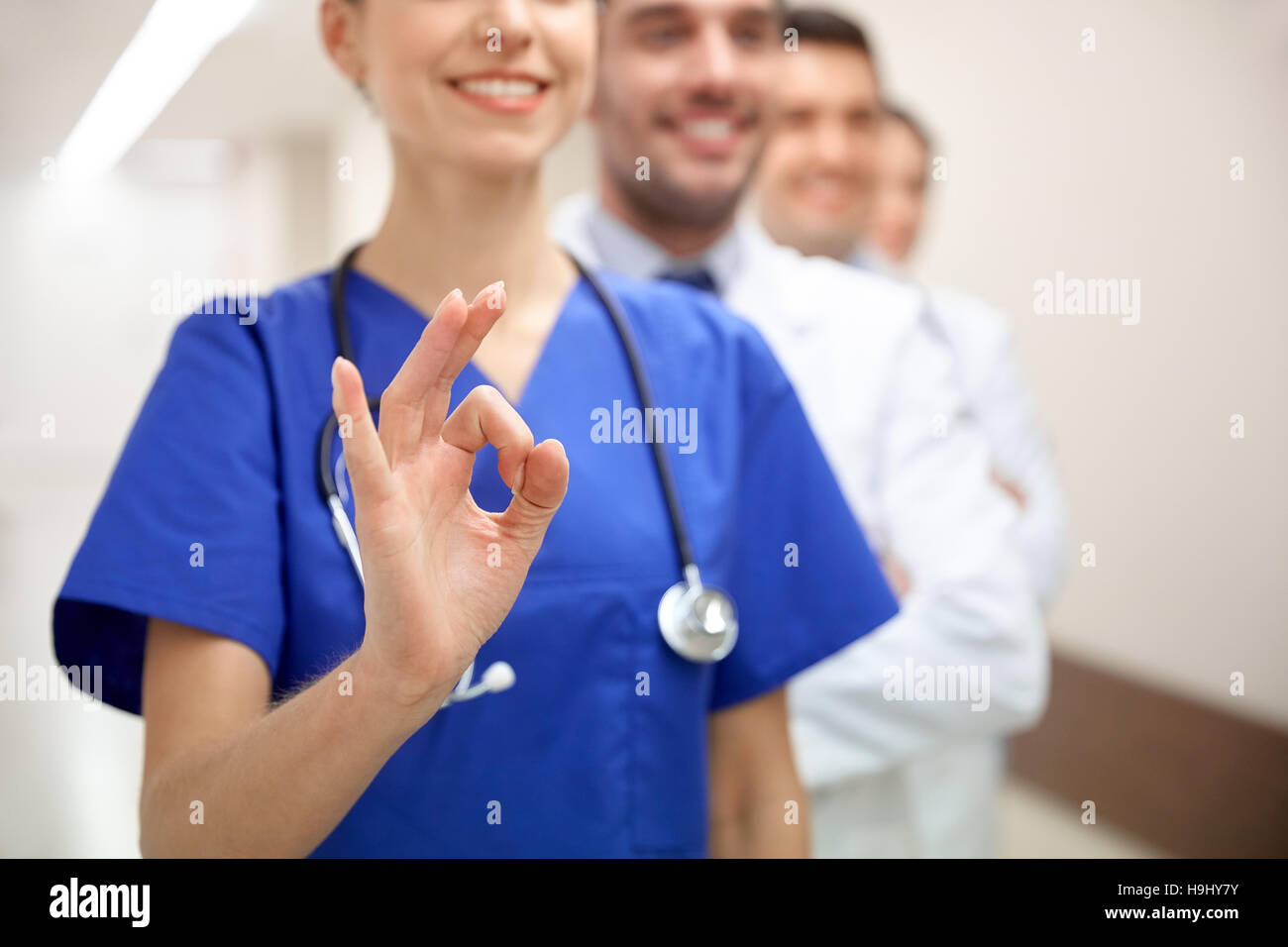 close up of doctors at hospital showing ok sign Stock Photo - Alamy