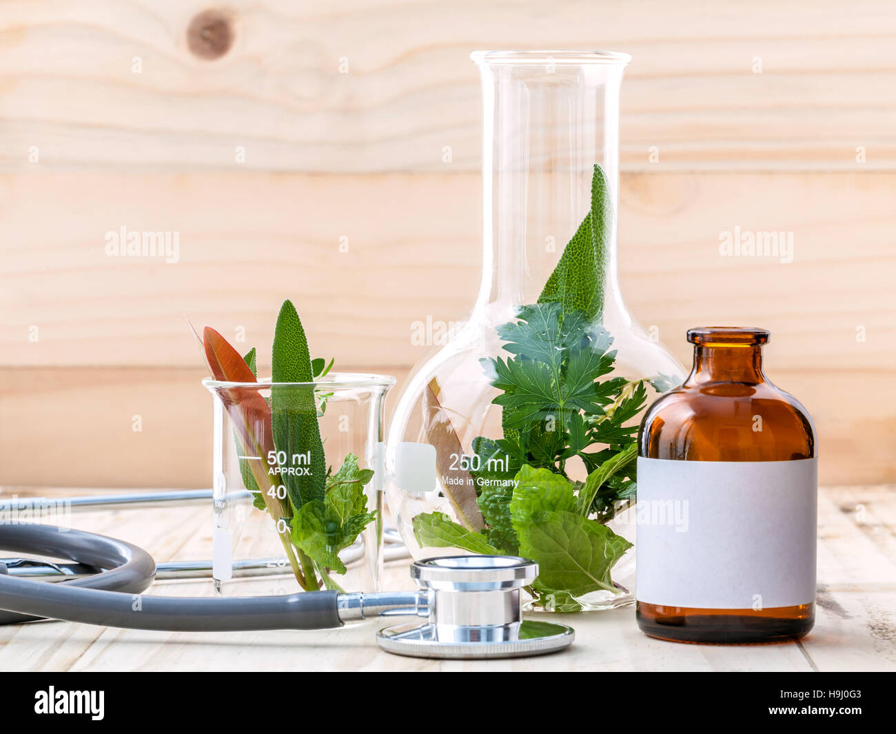 Alternative health care fresh herbal in laboratory glassware wi Stock ...