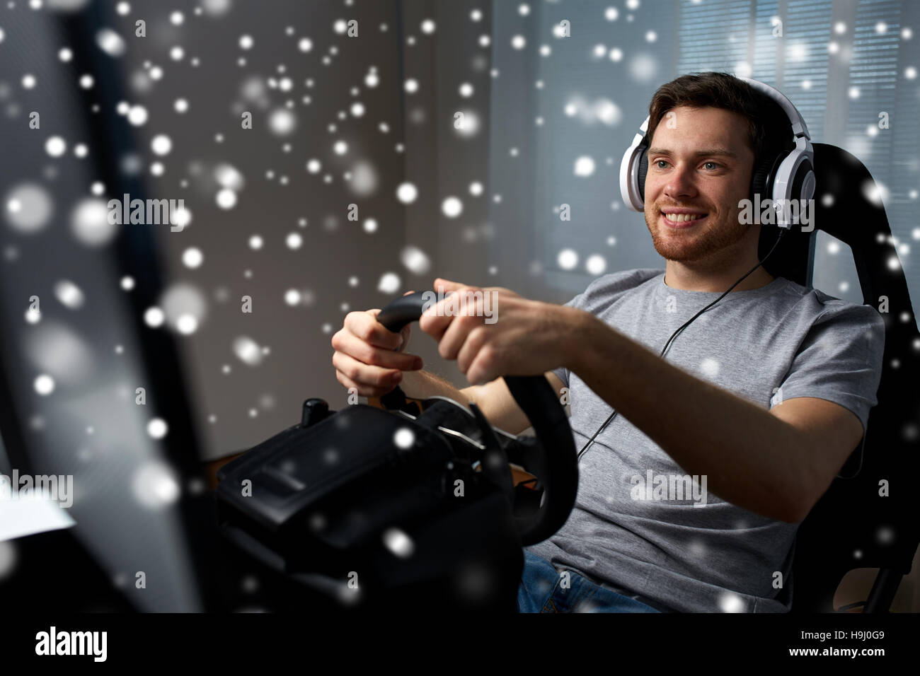 man playing car racing video game at home Stock Photo - Alamy