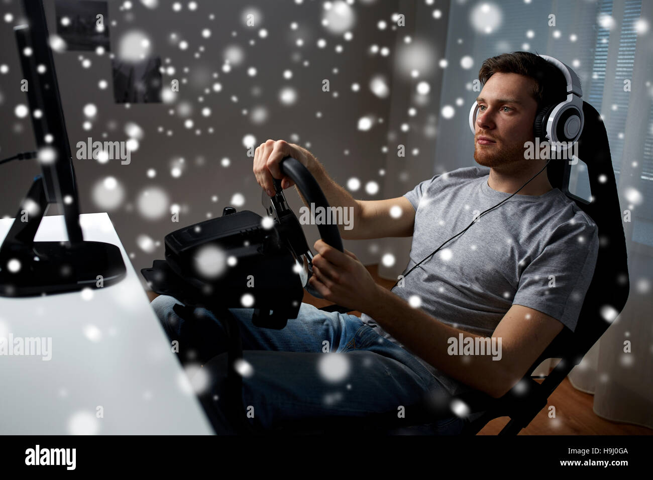 man playing car racing video game at home Stock Photo - Alamy