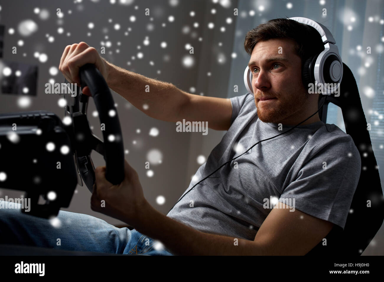 man playing car racing video game at home Stock Photo - Alamy