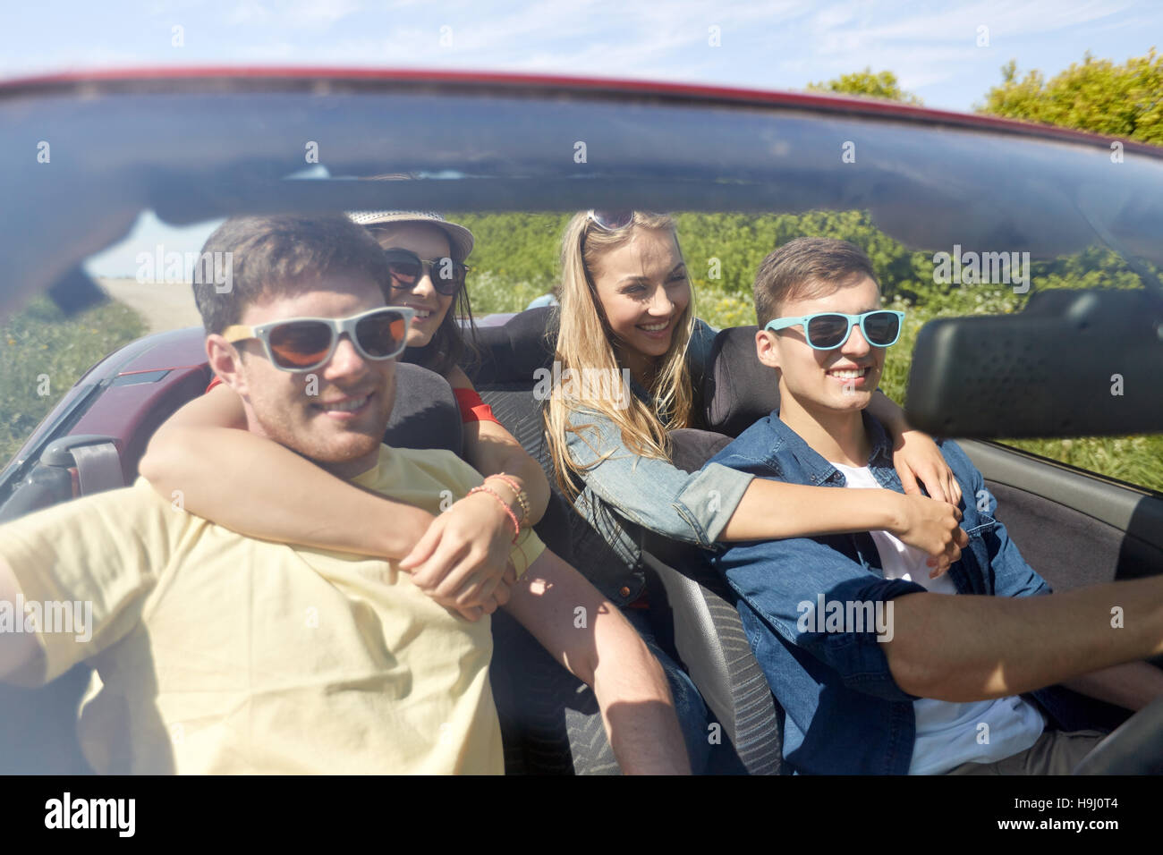 happy friends driving in cabriolet car outdoors Stock Photo - Alamy