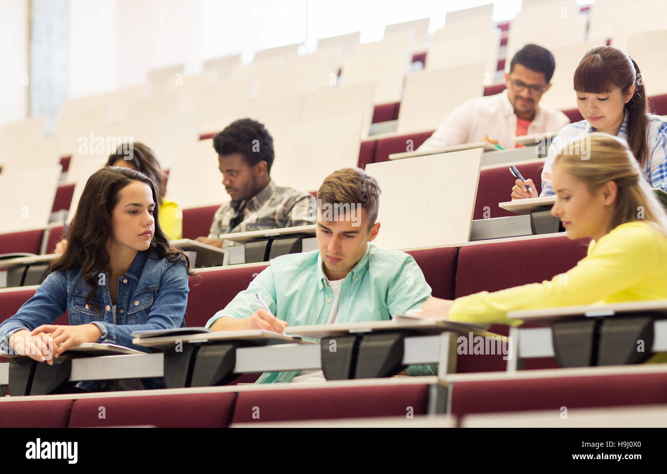 group of students with notebooks in lecture hall Stock Photo - Alamy