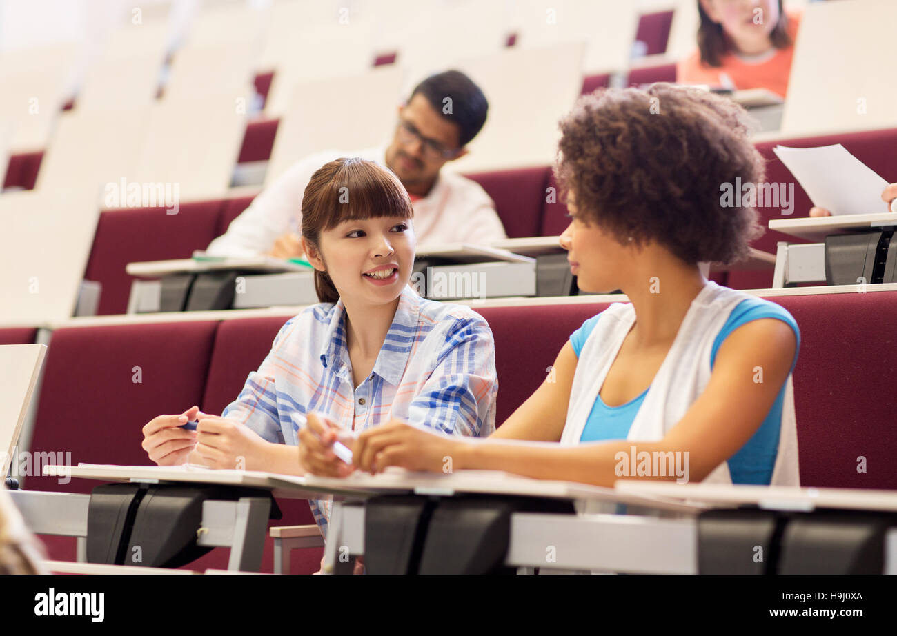 group of students talking in lecture hall Stock Photo - Alamy