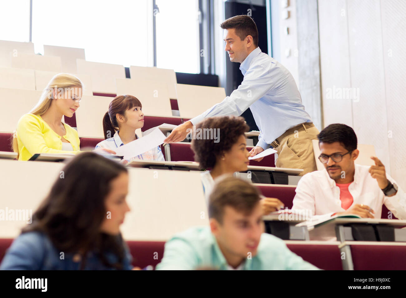 teacher giving test to students on lecture Stock Photo - Alamy