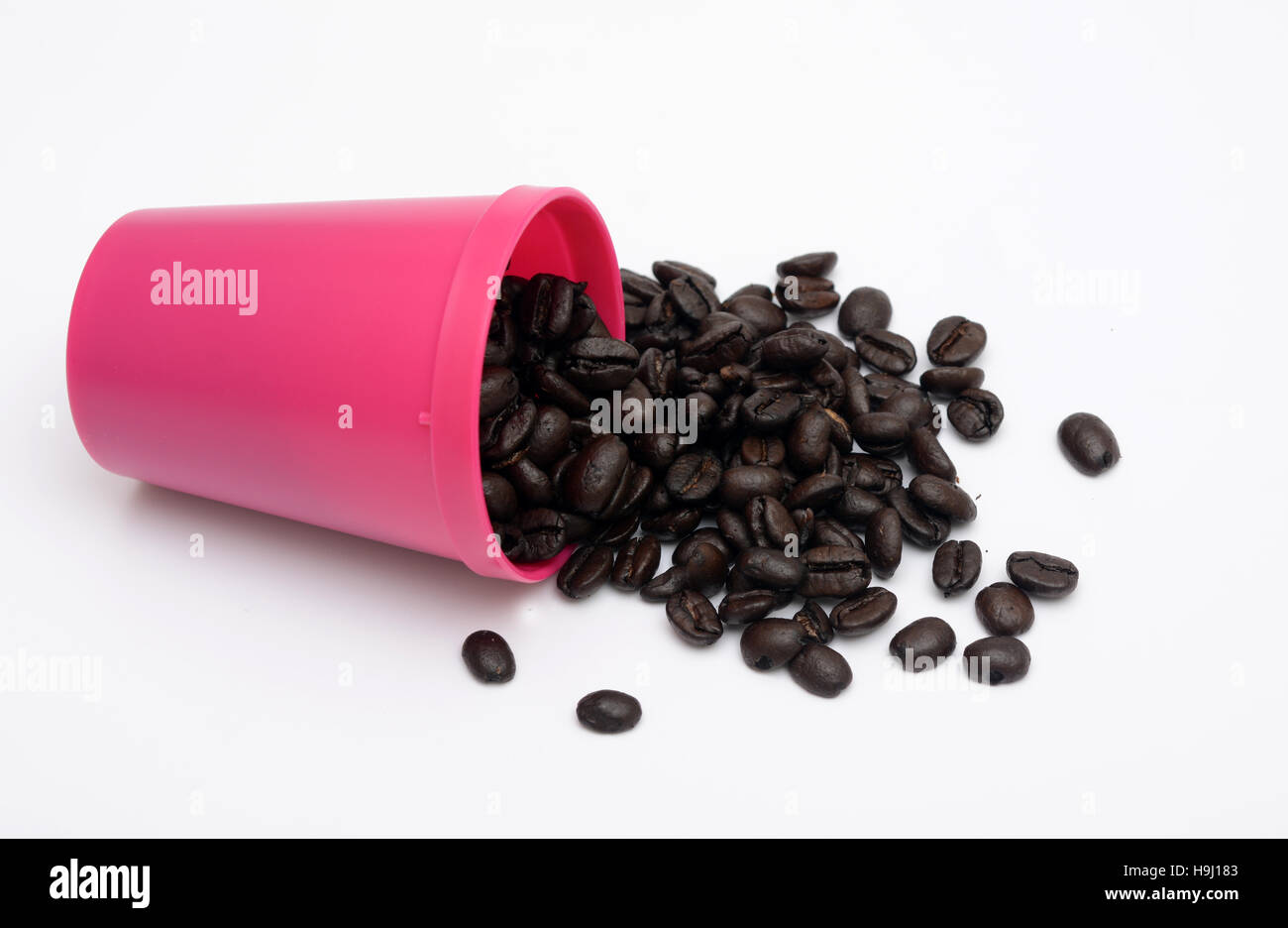 Roasted Coffee beans coming out of Pink Glass Stock Photo - Alamy