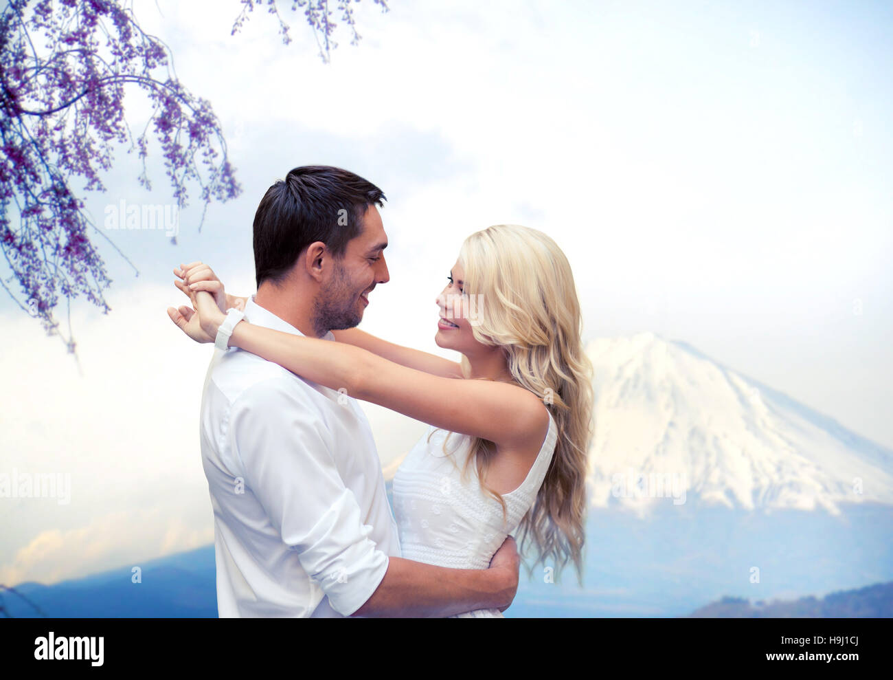 happy couple hugging over fuji mountain in japan Stock Photo - Alamy