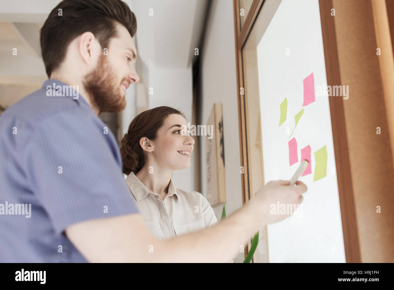 creative team with stickers on glass at office Stock Photo - Alamy