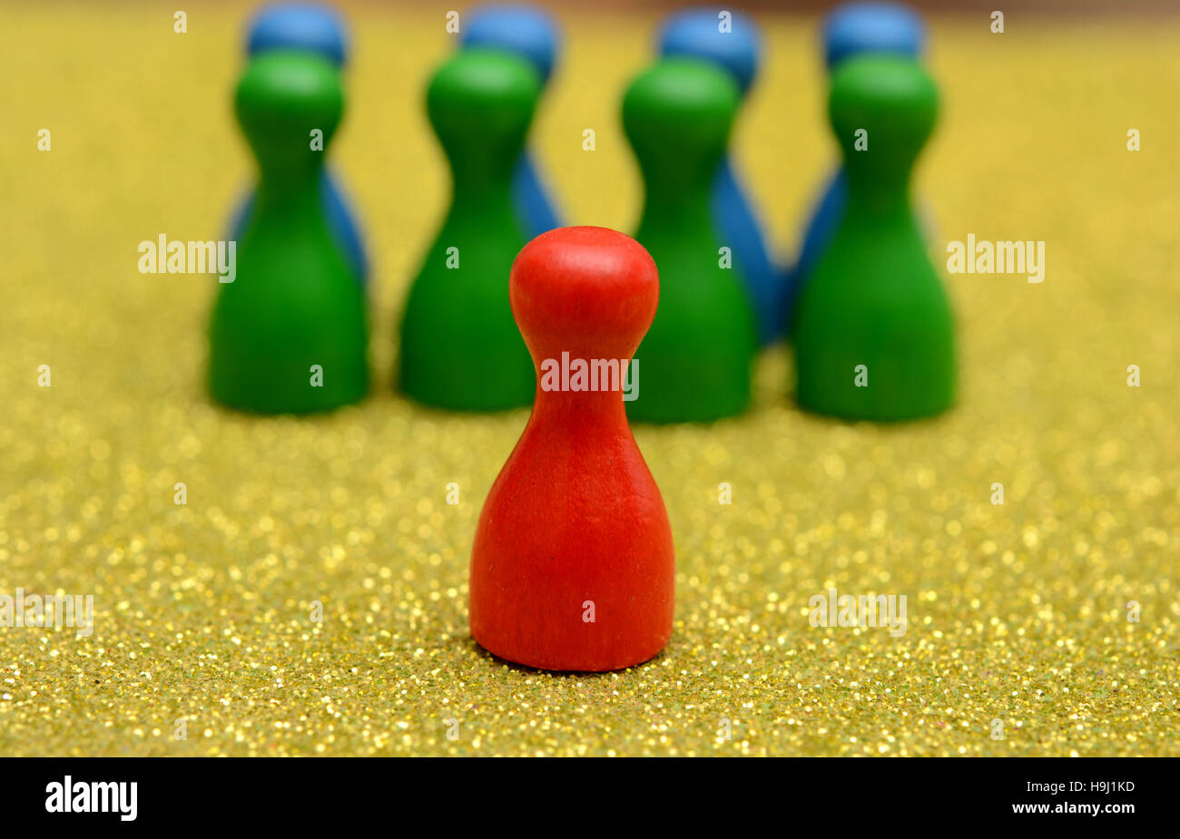 Red pawn standing on front with others in background Stock Photo - Alamy